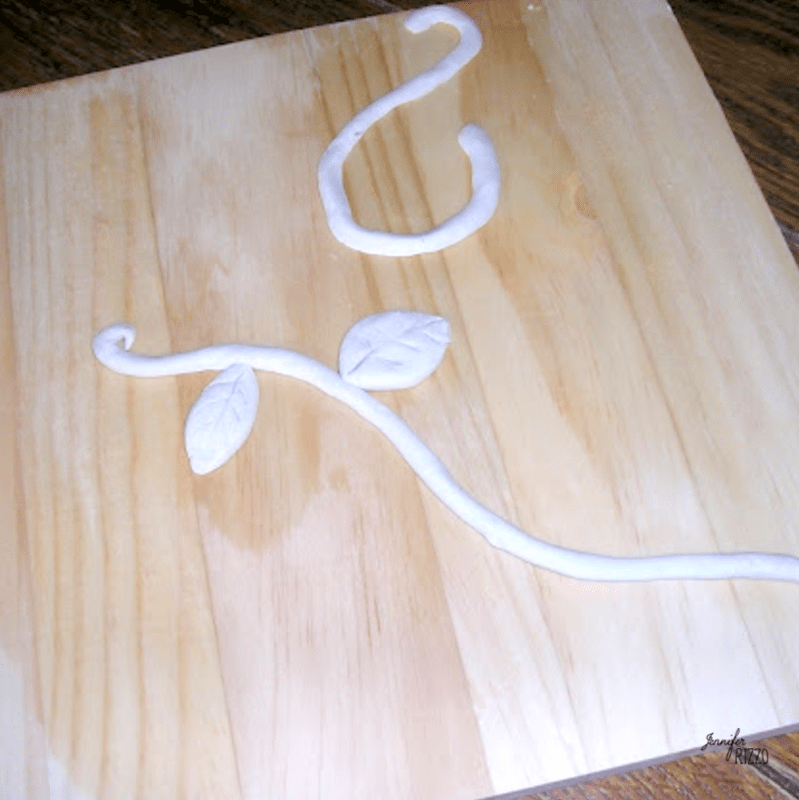 Use clay to make shapes on the wood - Jennifer Rizzo